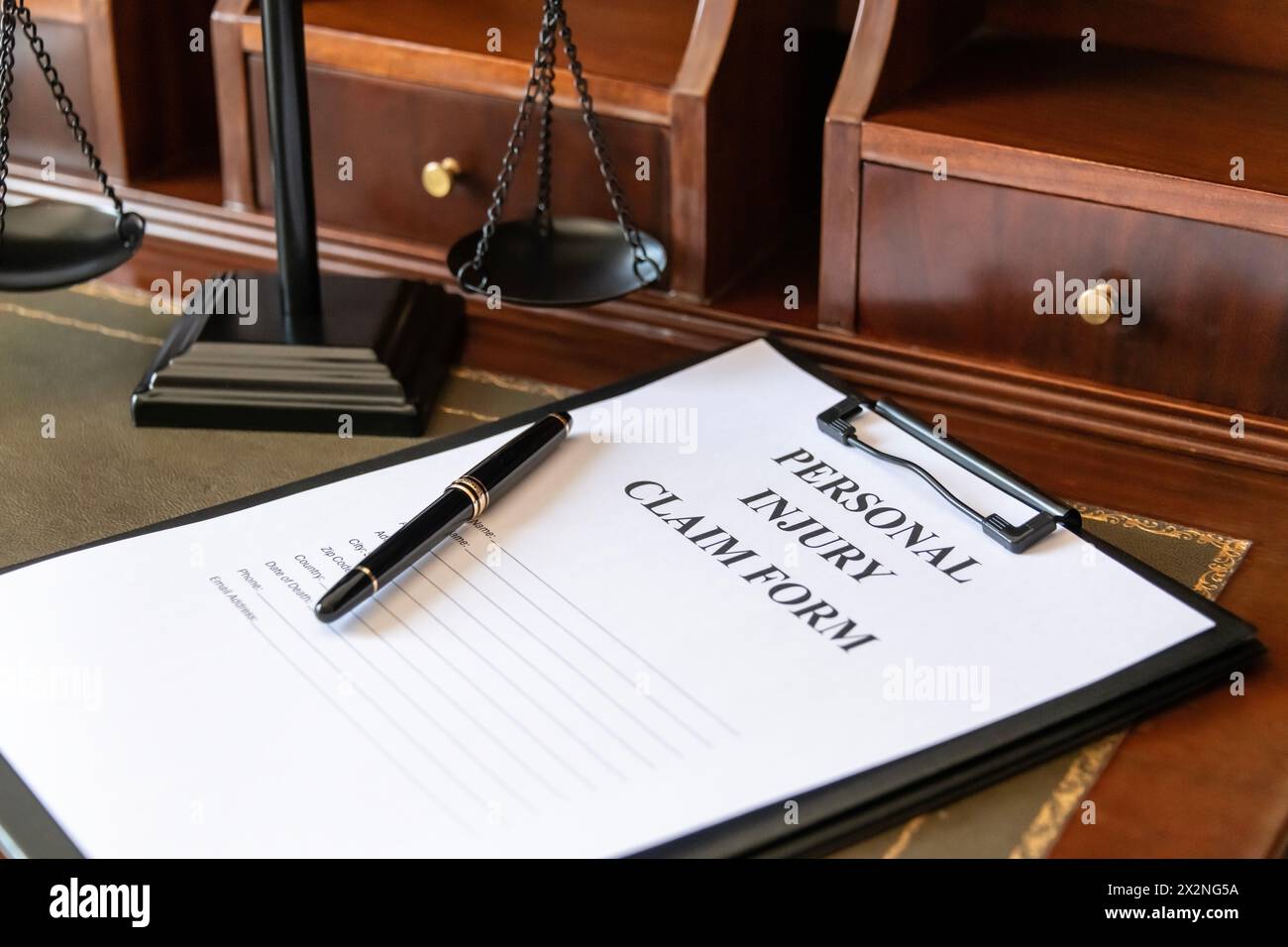 Legal Personal Injury Claim Form with Scales of Justice Stock Photo - Alamy