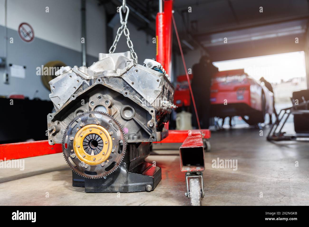 Motorsport pit lane garage box paddock hanged v8 engine suspended crane ...