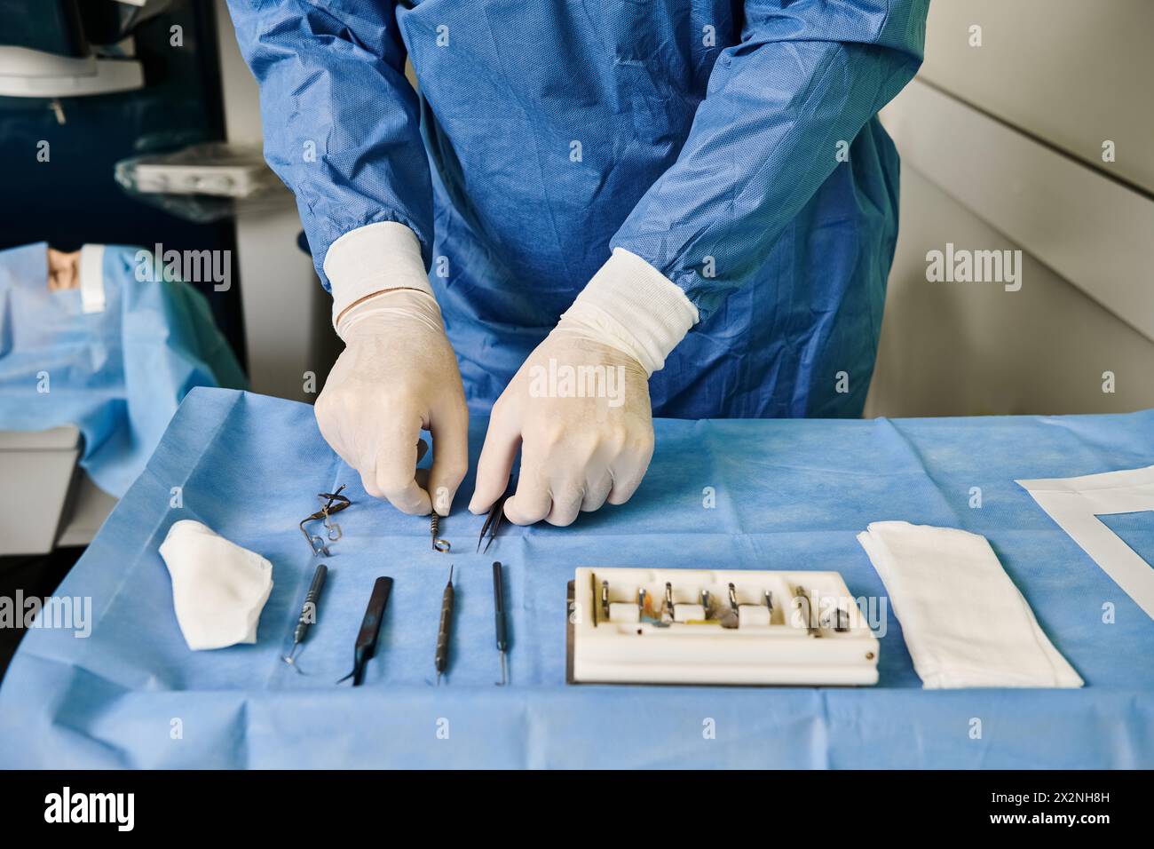 Man in medical gown operates laser vision correction machine Stock ...