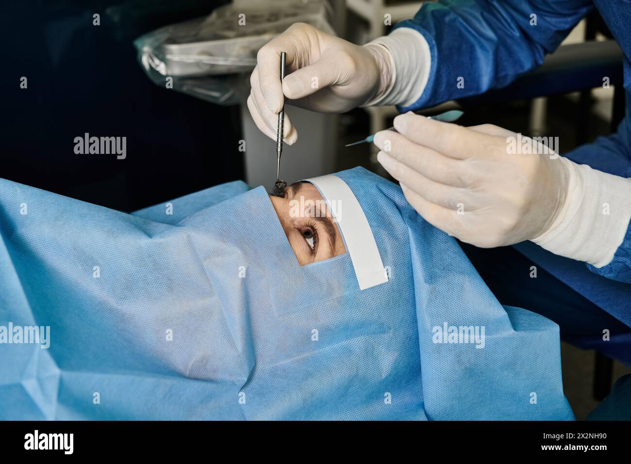 Surgeon wearing mask performing laser vision correction on womans face ...