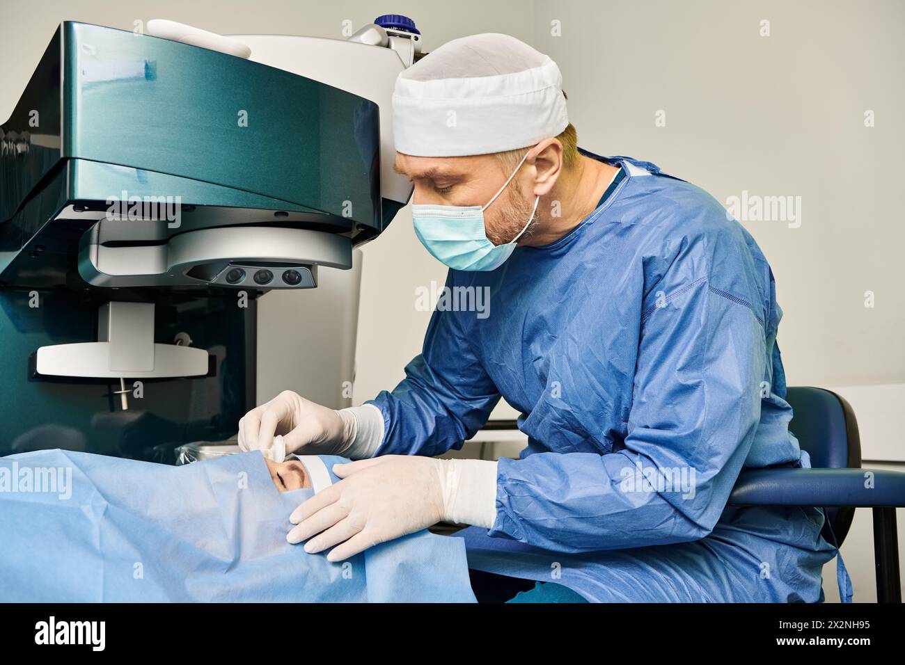 A person in a surgical gown operates a laser vision correction machine ...