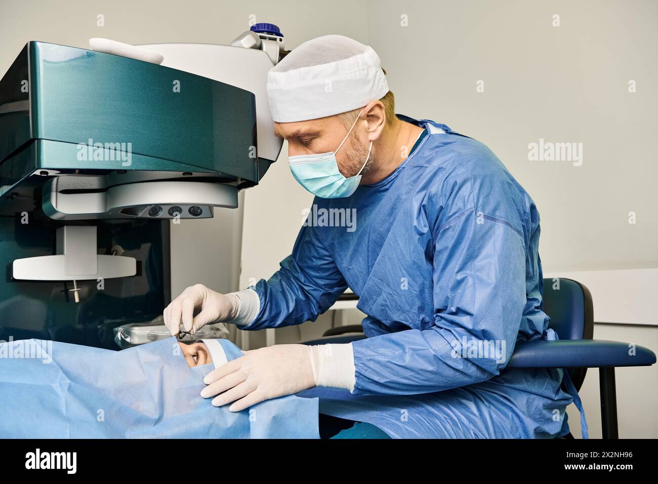 A man in scrubs operates a machine during a laser vision correction ...