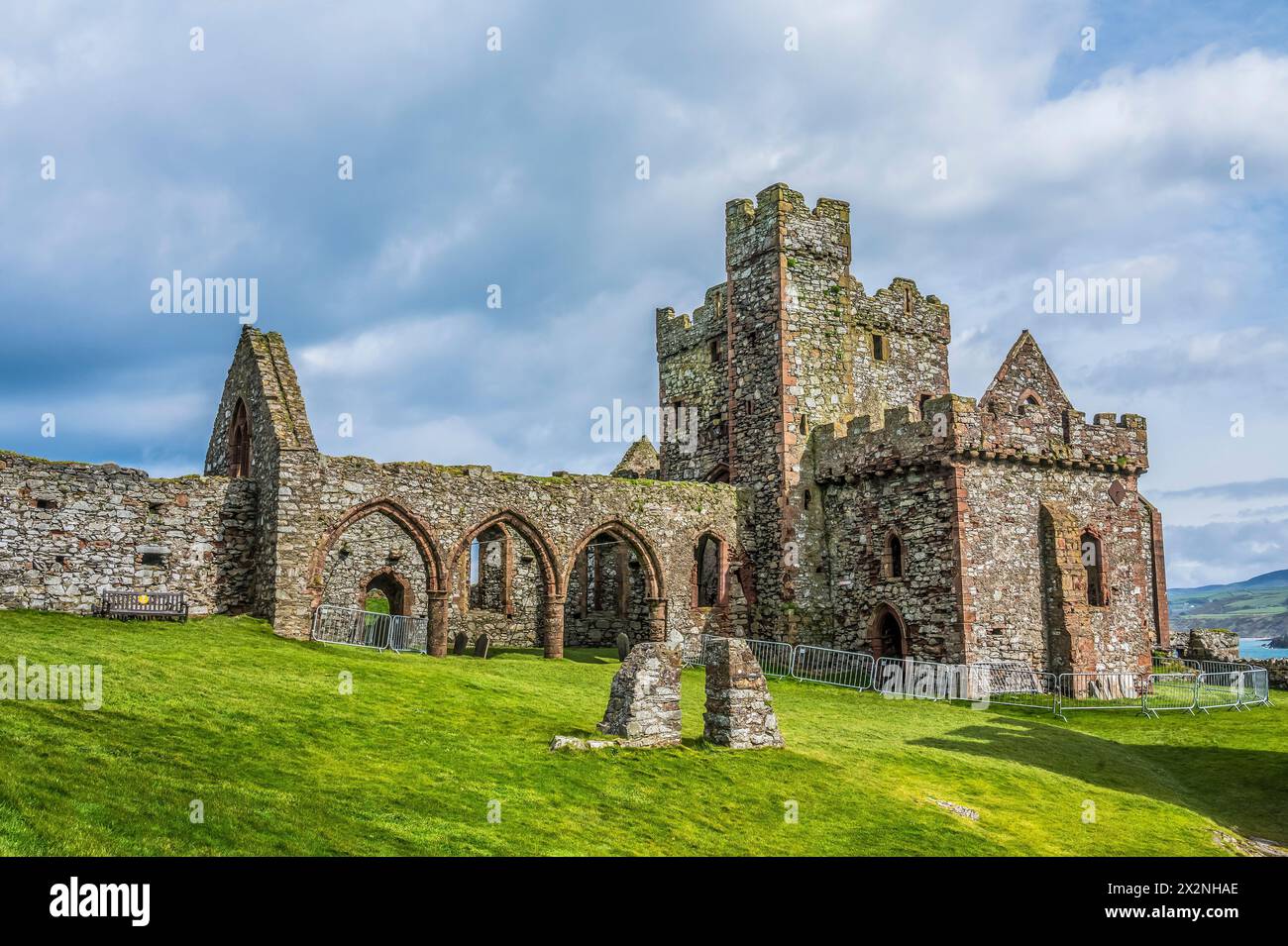 The image is of the 12th century historic Peel Castle Abbey on the west ...