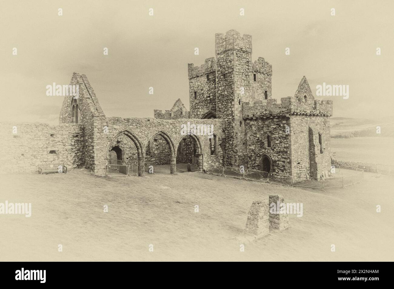 The image is of the 12th century historic Peel Castle Abbey on the west ...