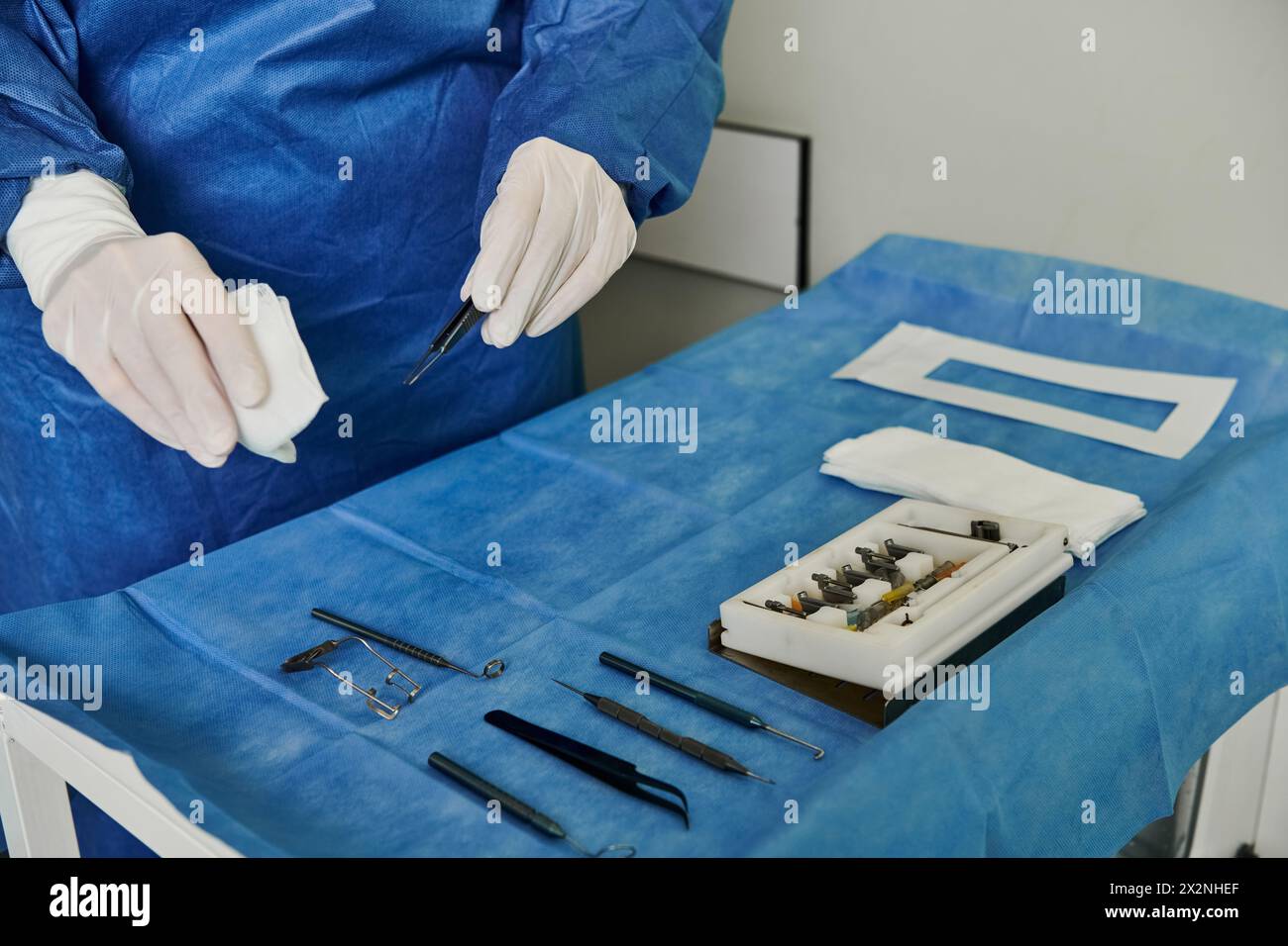 A person in a blue suit and white gloves at a doctors office for laser ...
