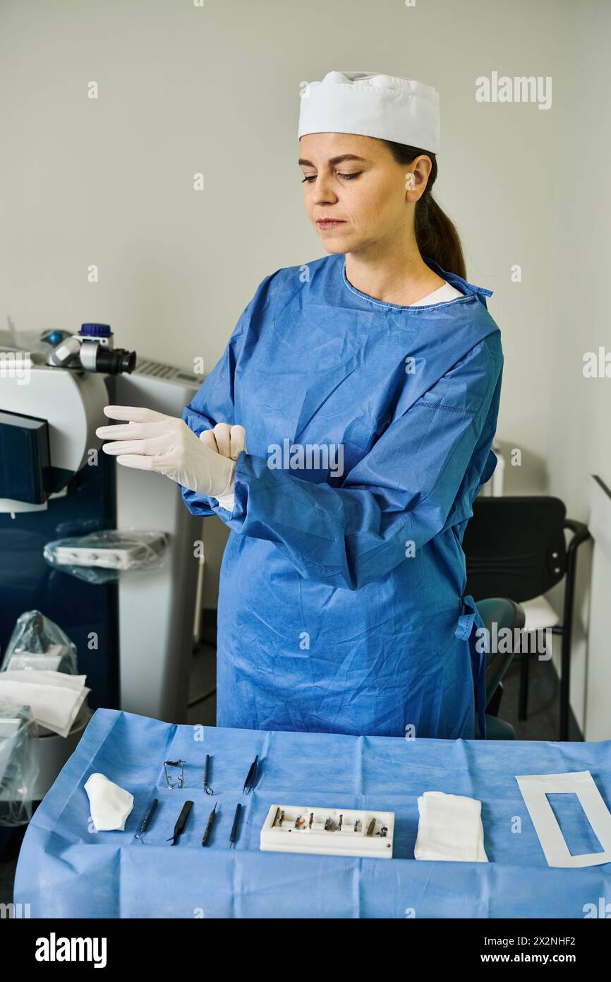 Surgeon standing beside surgical table hi-res stock photography and ...