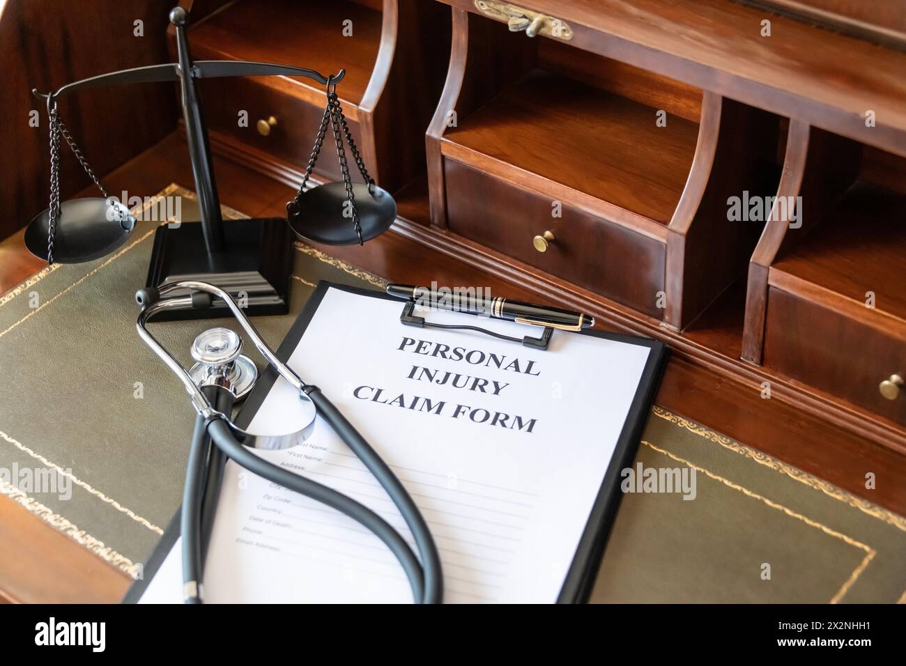 Legal Personal Injury Claim Form with Scales of Justice Stock Photo - Alamy