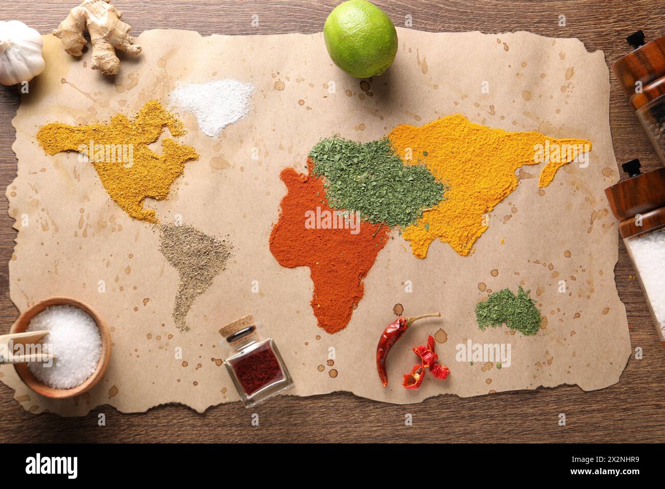 World map of different spices and products on wooden table, top view ...