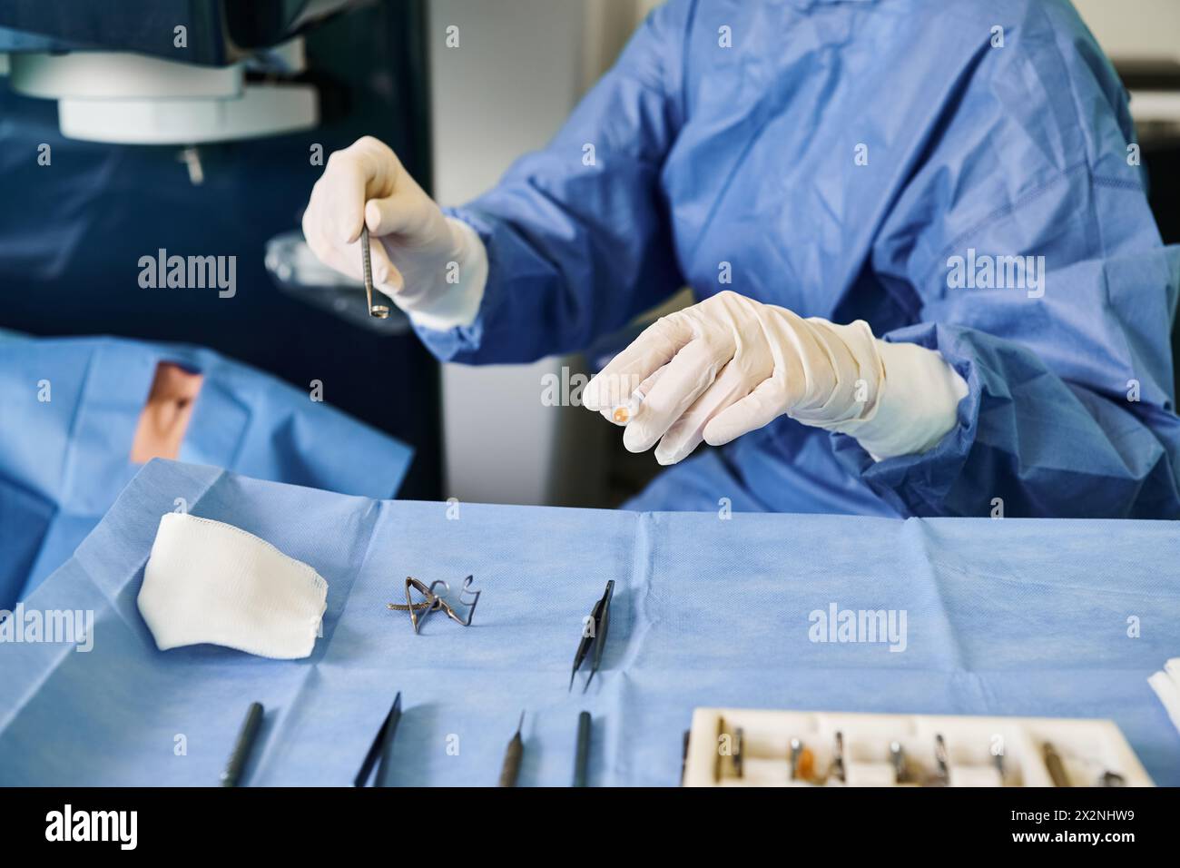 Surgeon in surgical attire preparing for laser vision correction ...