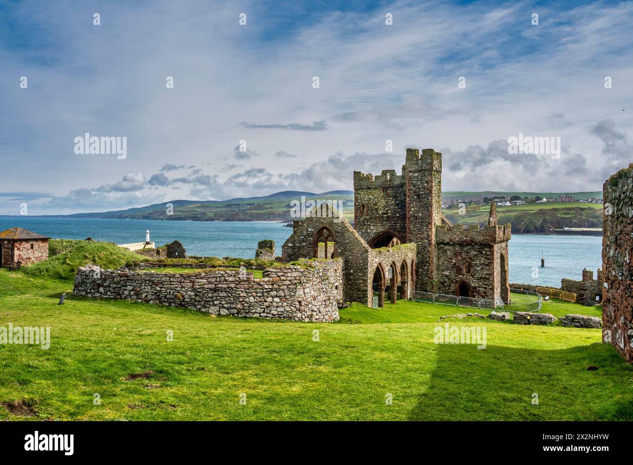 The image is of the 12th century historic Peel Castle Abbey on the west ...