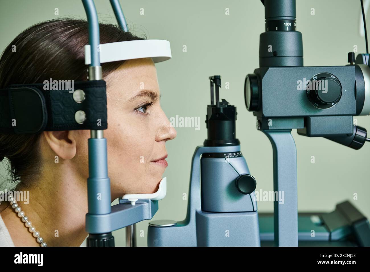 Beautiful female patient checking her vision Stock Photo - Alamy