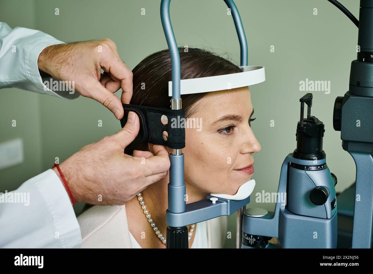 Woman at doctors office undergoing eye examination for laser vision ...