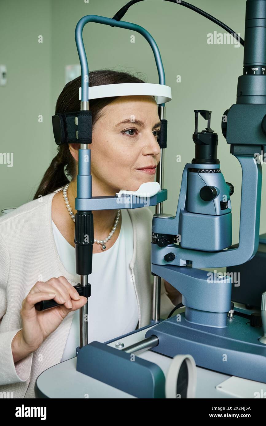 Pretty female patient checking her vision Stock Photo - Alamy