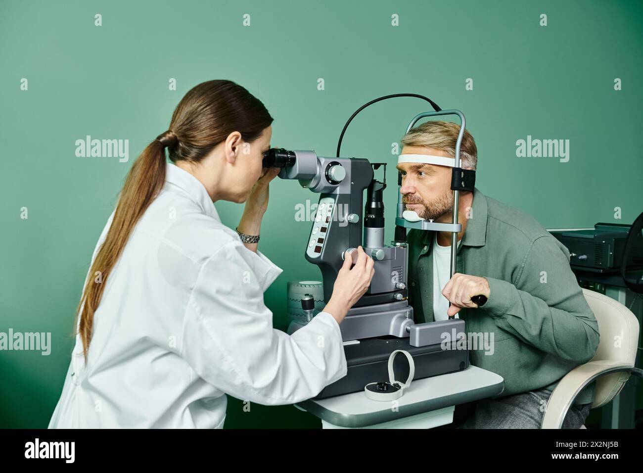 Beautiful doctor examining a mans eye in a professional setting Stock ...