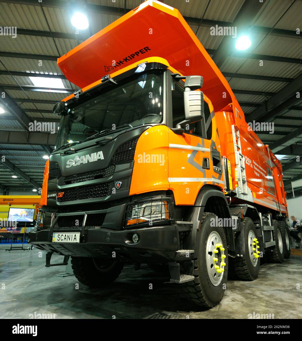 New model of a dump truck Scania presented on a stand. Exhibition Heavy ...
