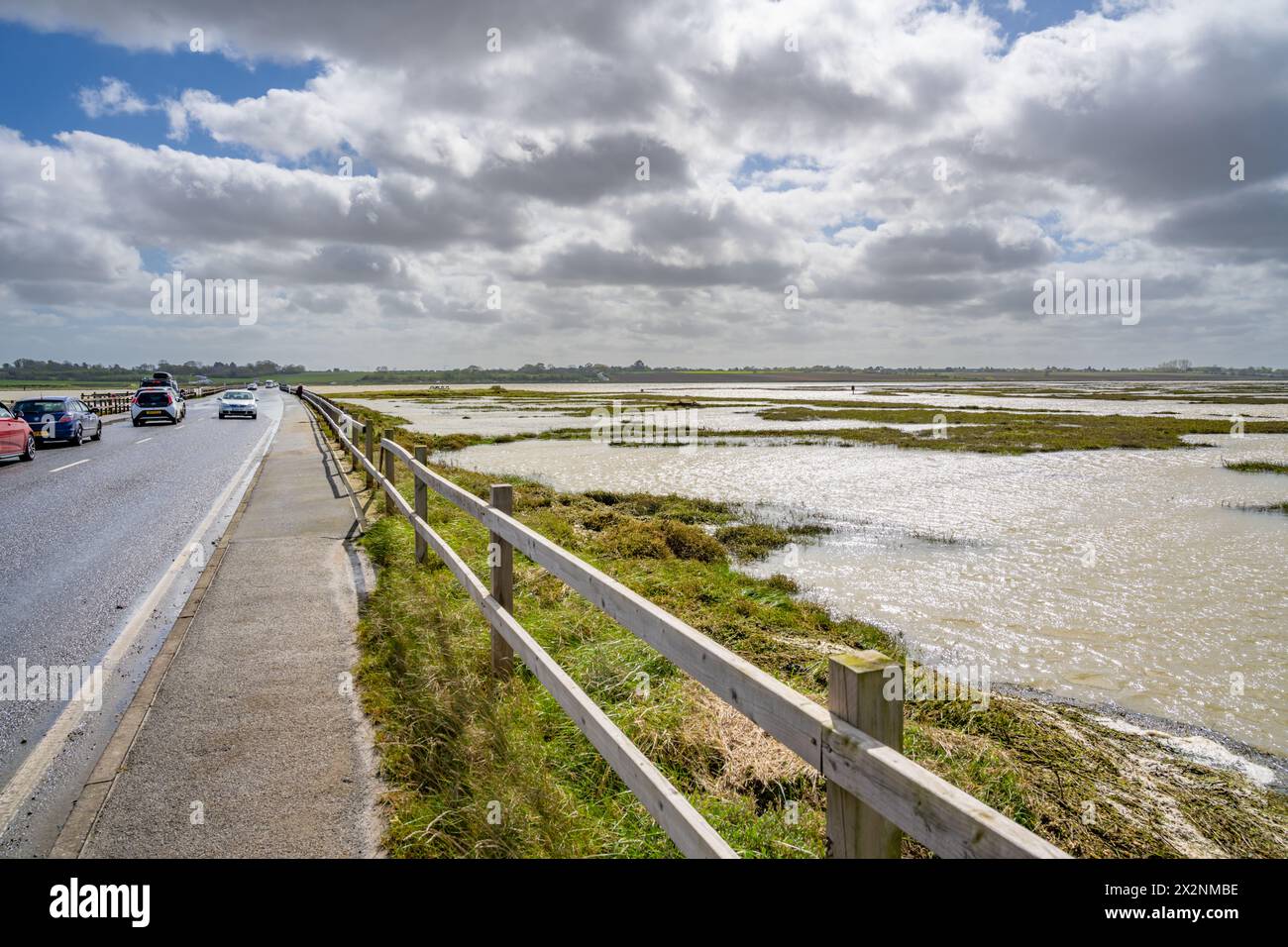 Traffic queueing to cross The Strood to Mersea Island Essex. The ...