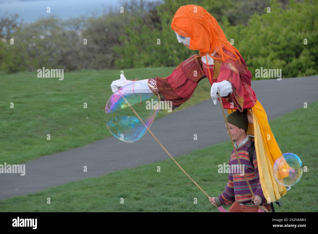 giant puppet making huge soap bubbles Stock Photo - Alamy
