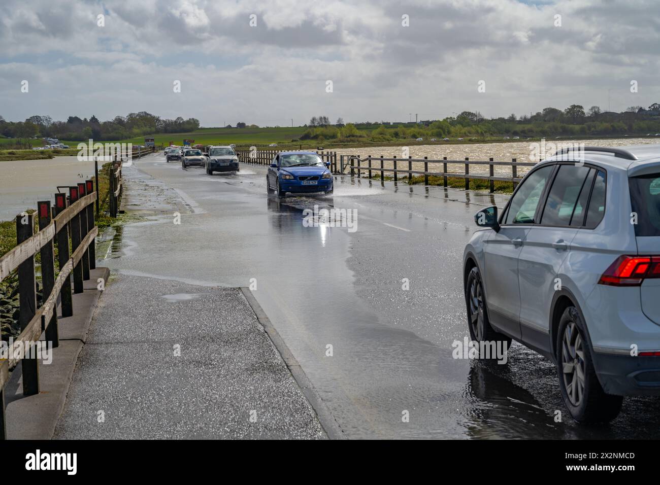 Traffic queueing to cross The Strood to Mersea Island Essex. The ...