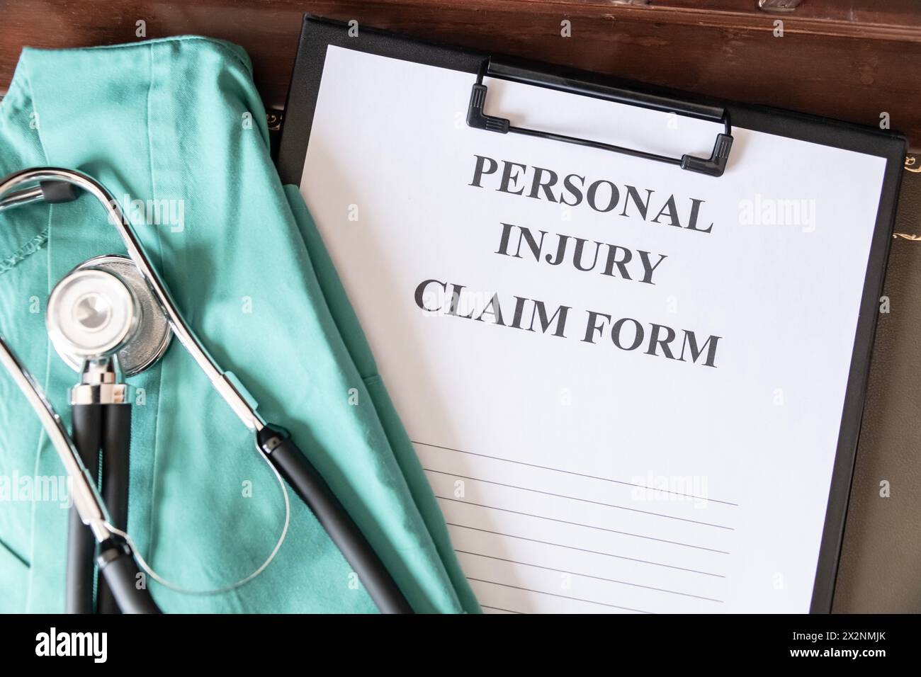 A personal injury claim form on a clipboard, accompanied by a ...