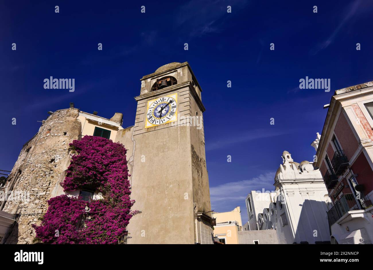 Italy, Campania, Capri island, the old clock and red bouganville near ...