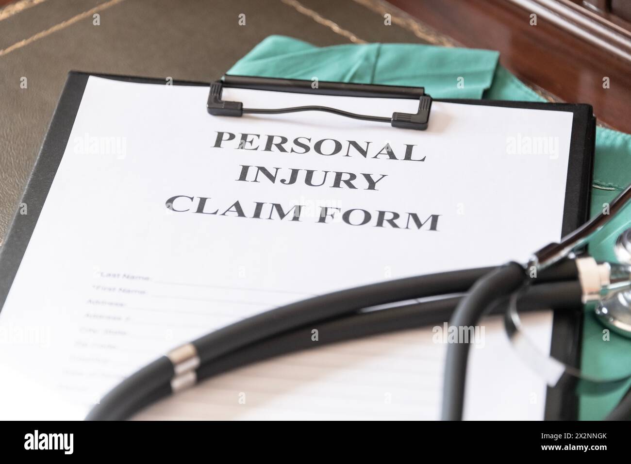 A personal injury claim form on a clipboard, accompanied by a ...