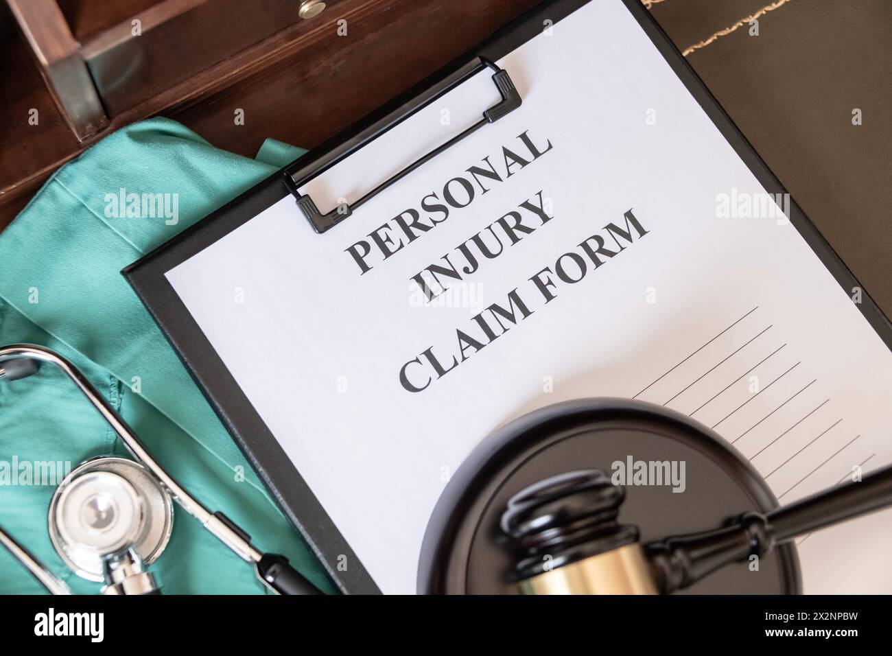 A personal injury claim form on a clipboard, accompanied by a ...