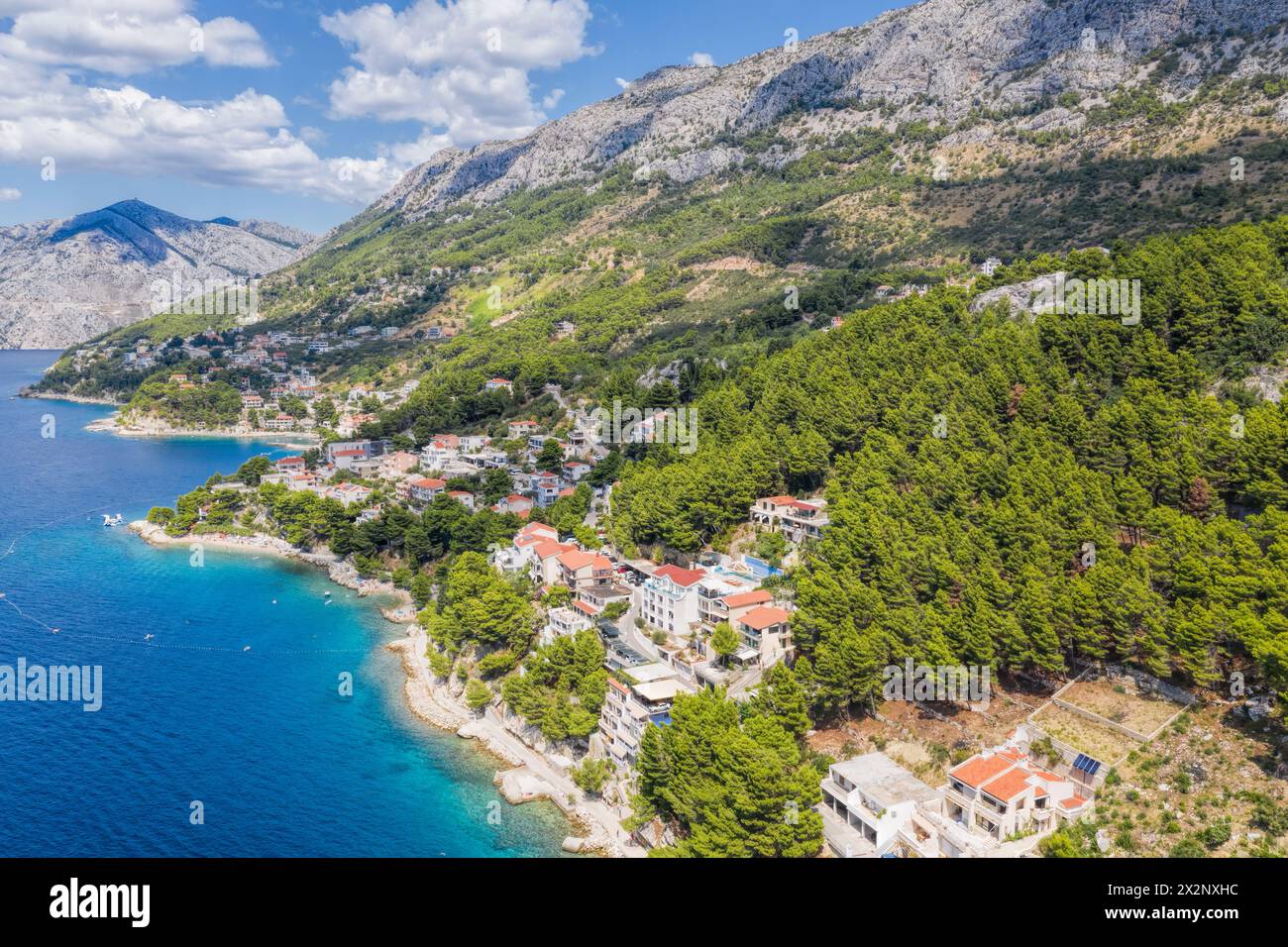 Aerial view of Punta Rata beach with boats and azure sea in Brela ...