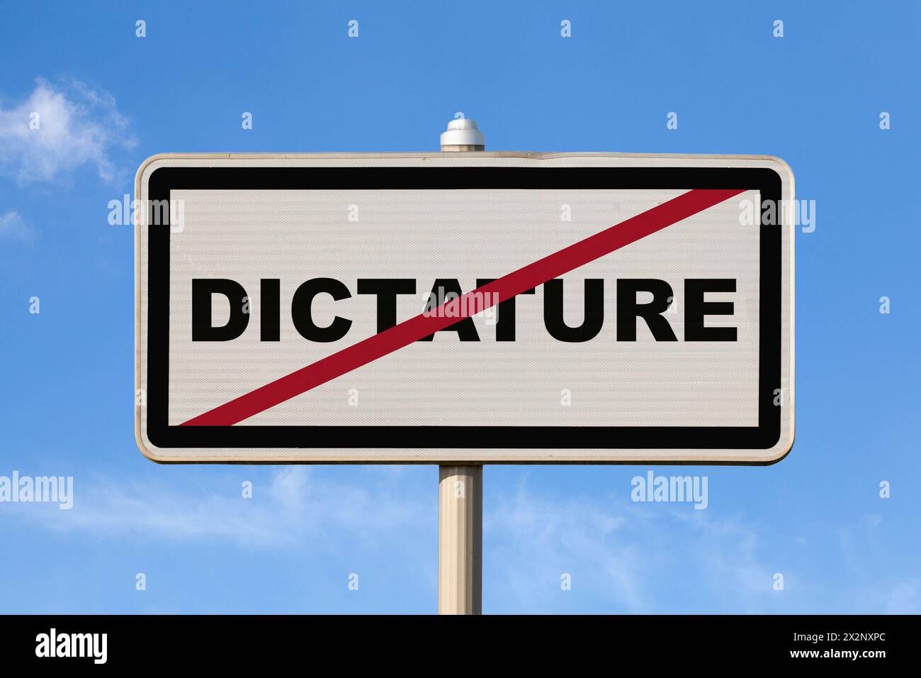 A French exit city sign against a blue sky with written in the middle ...