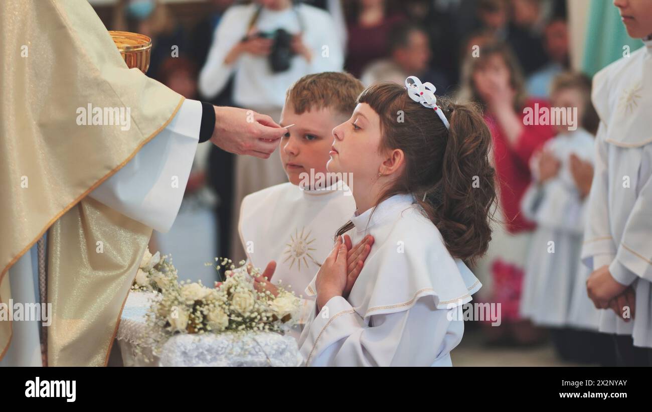 Child priest first holy communion hi-res stock photography and images ...