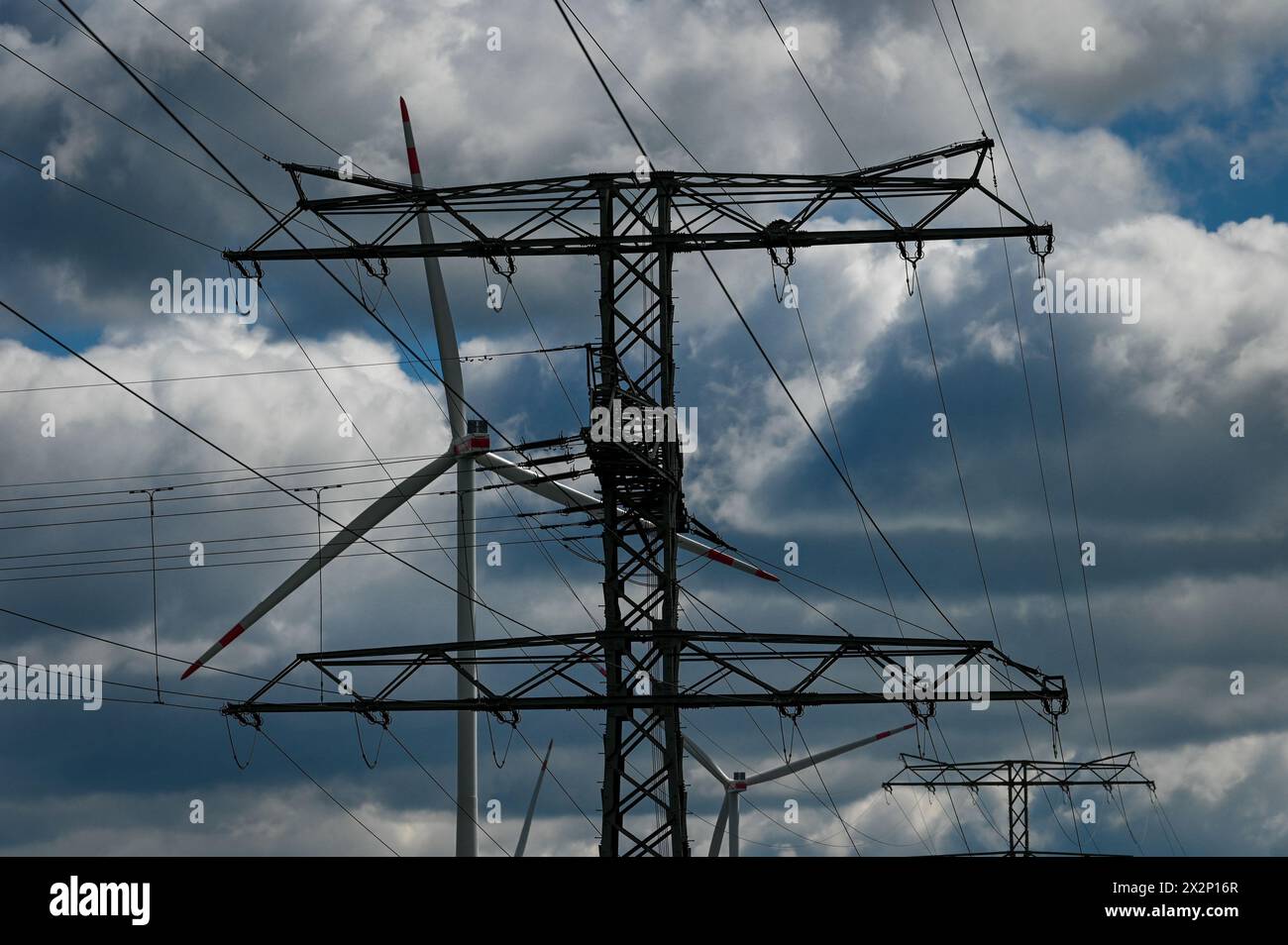 22 April 2024, Saxony-Anhalt, Bad Lauchstädt: Power line pylons and ...