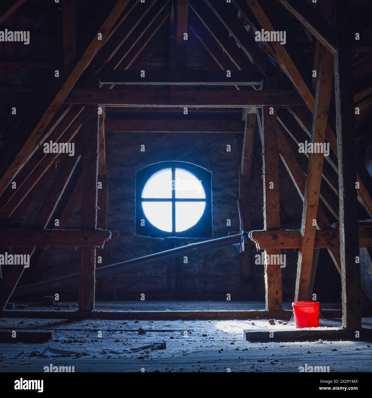 An old attic with a round window, roof truss, round window, old and ...