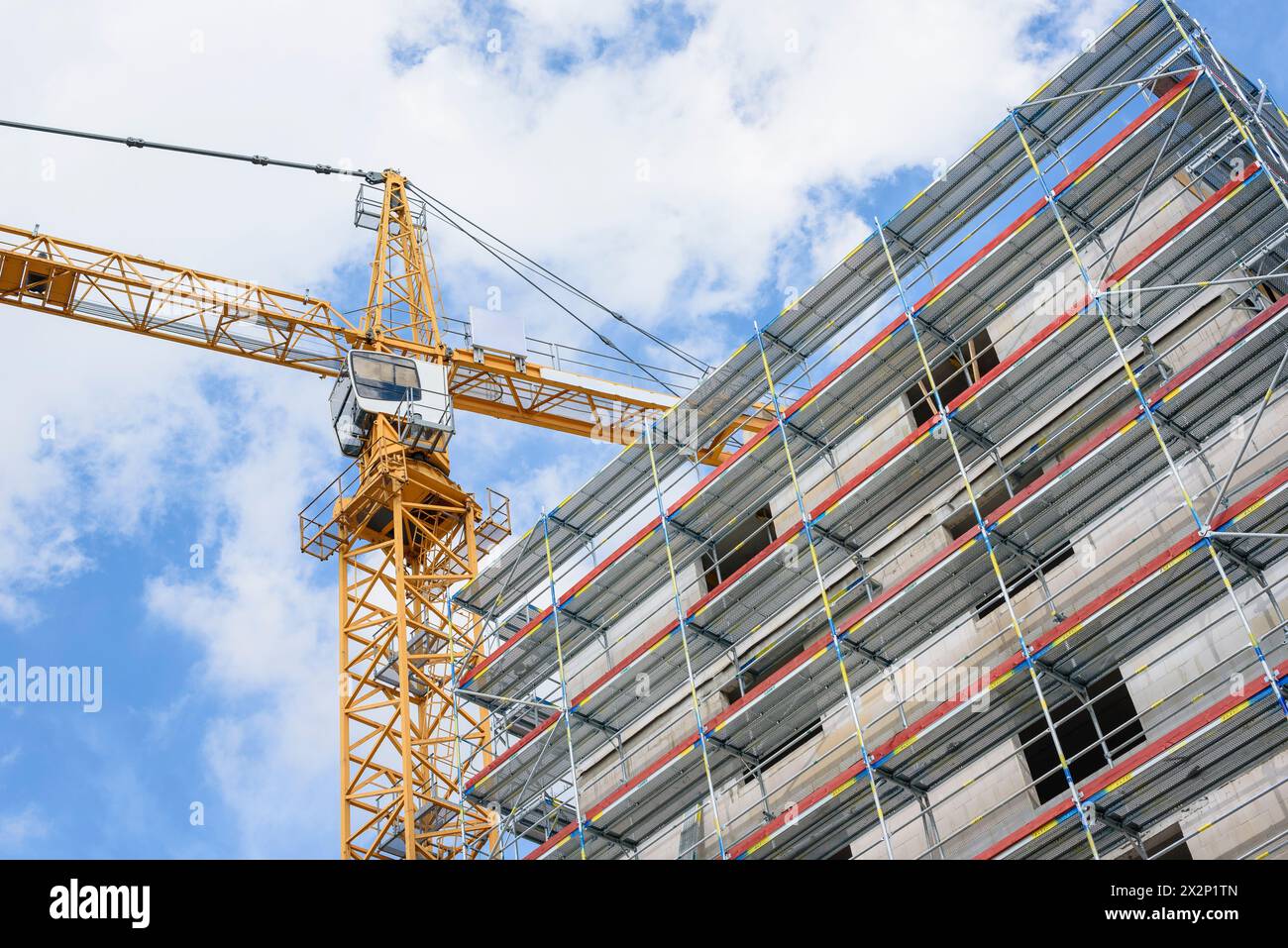 A scaffolding with a crane, construction site with a crane and ...