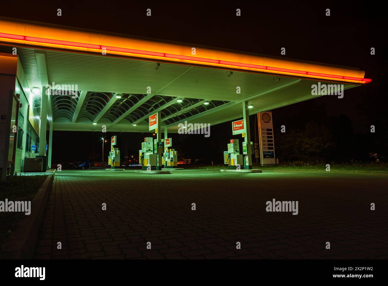 a shell gas station at night, no cars, empty, lit up Stock Photo - Alamy