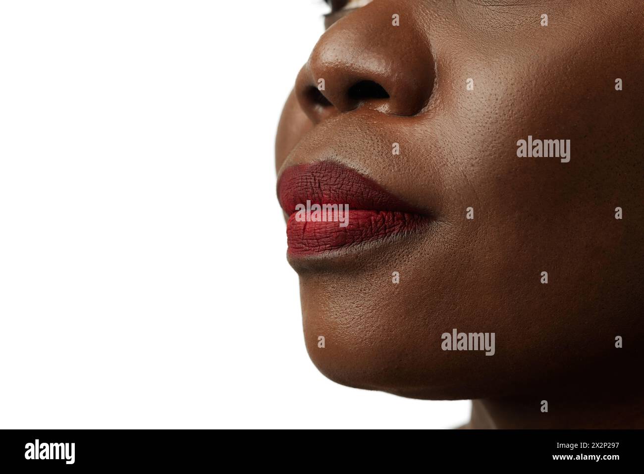 Cropped image of African woman's face, nose, lips isolated on white ...