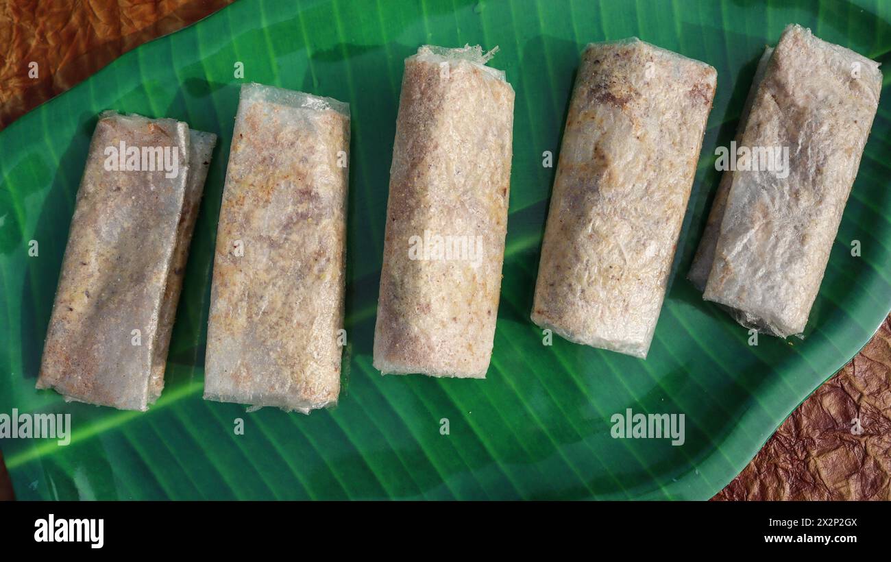 Traditional Andhra sweet Pootharekulu made from paper thin sheet made ...