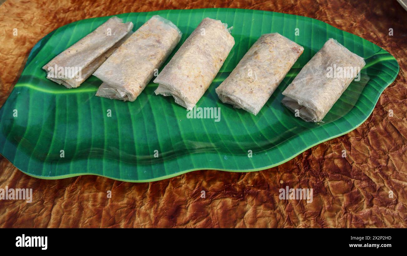 Traditional Andhra sweet Pootharekulu made from paper thin sheet made ...