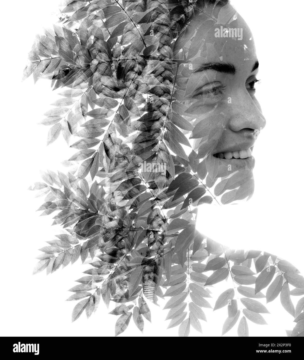 A disappearing black and white double exposure portrait of a smiling ...
