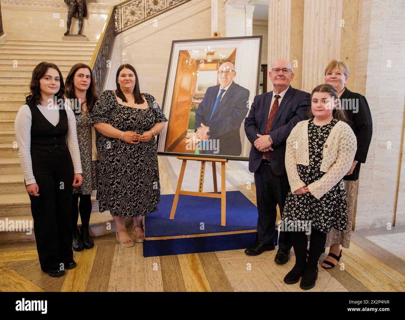Former Stormont Assembly speaker Lord William Hay and his family stand ...