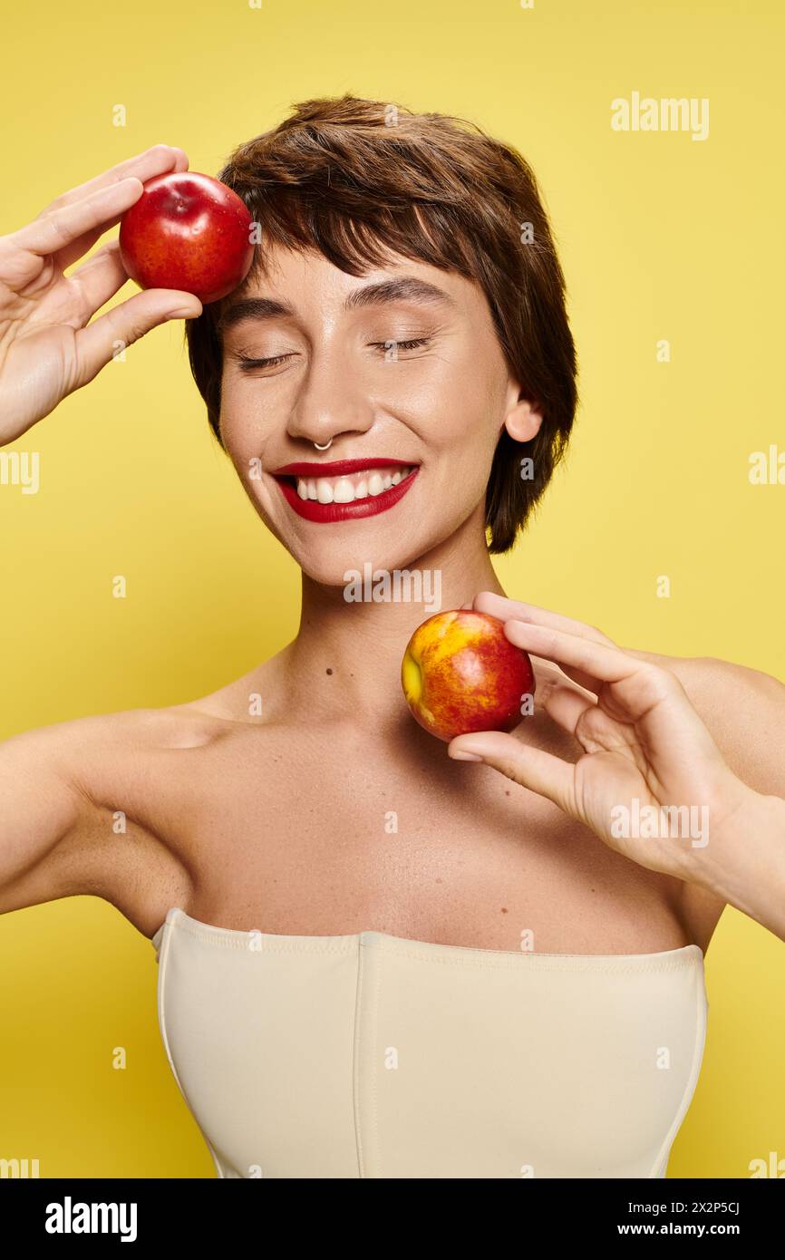 Woman eating peaches hi-res stock photography and images - Alamy