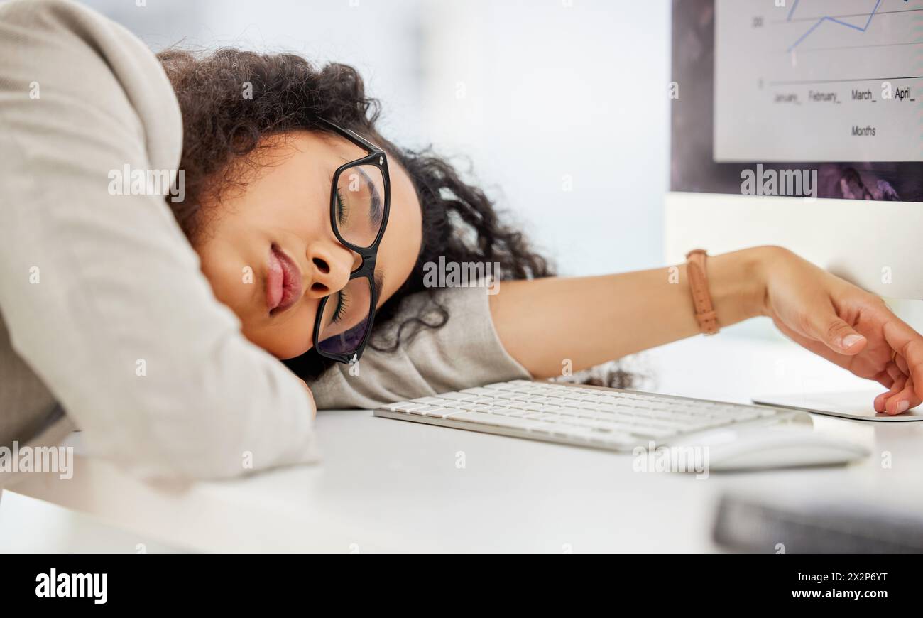 Burnout, fatigue or sleep and business woman on desk in office ...