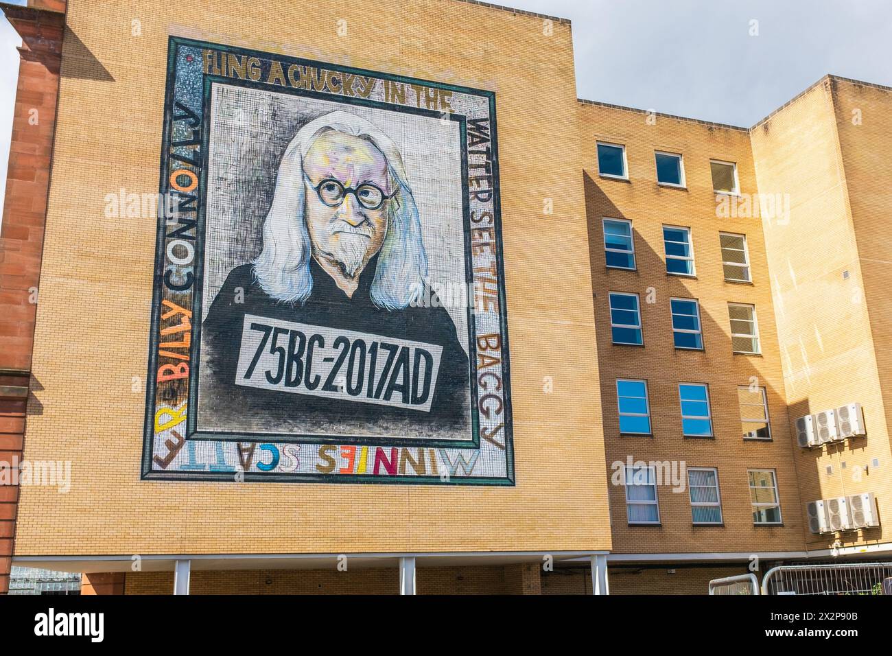 Mural of Billy Connolly, Glasgow comedian, on the wall of a block of ...