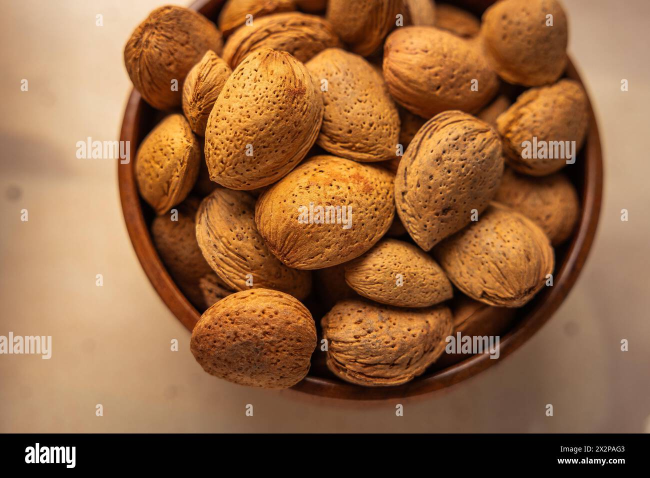 bowl full of almonds, a very nutritious and healthy nut Stock Photo - Alamy