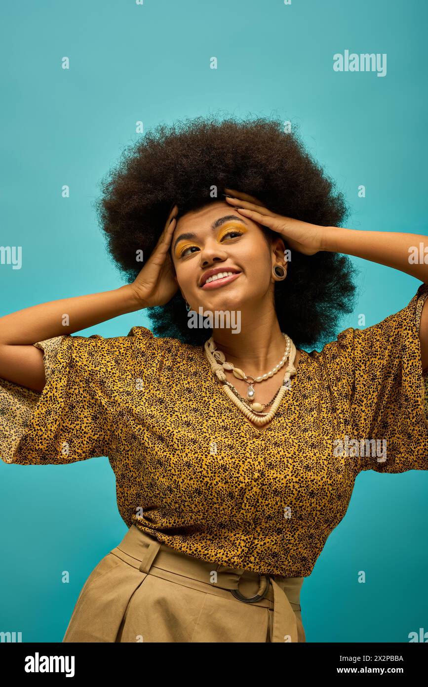 Stylish African American woman with a voluminous afro posing ...