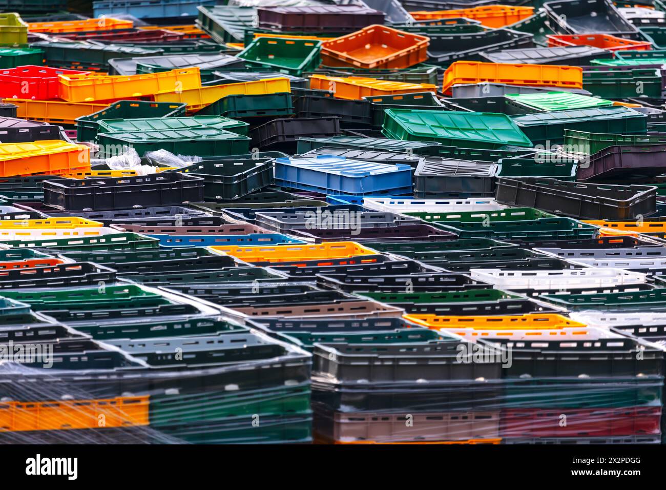 A lot of colorful plastic containers for waste sorting and recycling ...