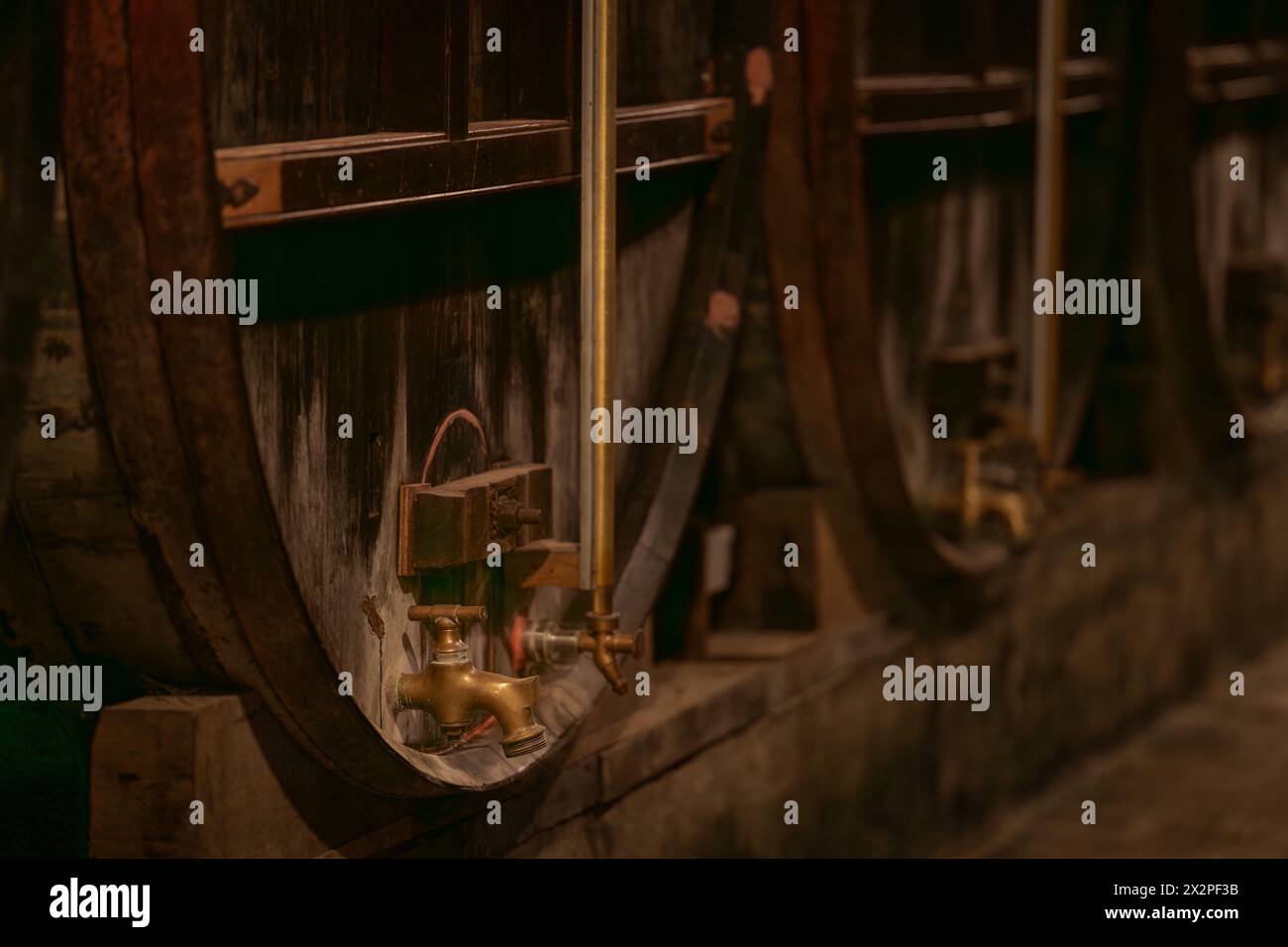 Close up of oak barrels in Calvados distillery. Calvados production ...