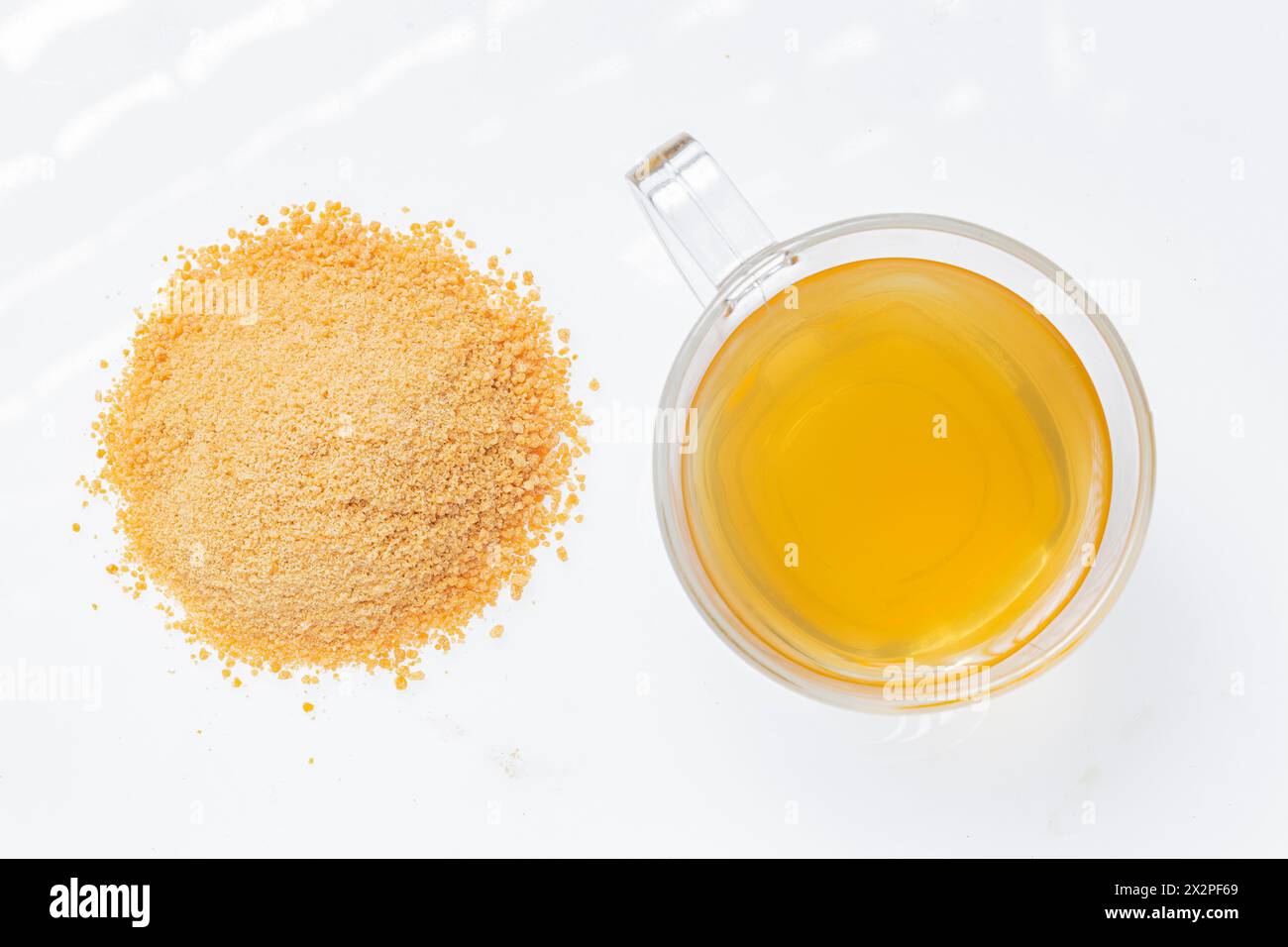 Drink of piloncillo and ground piloncillo, on white background ...