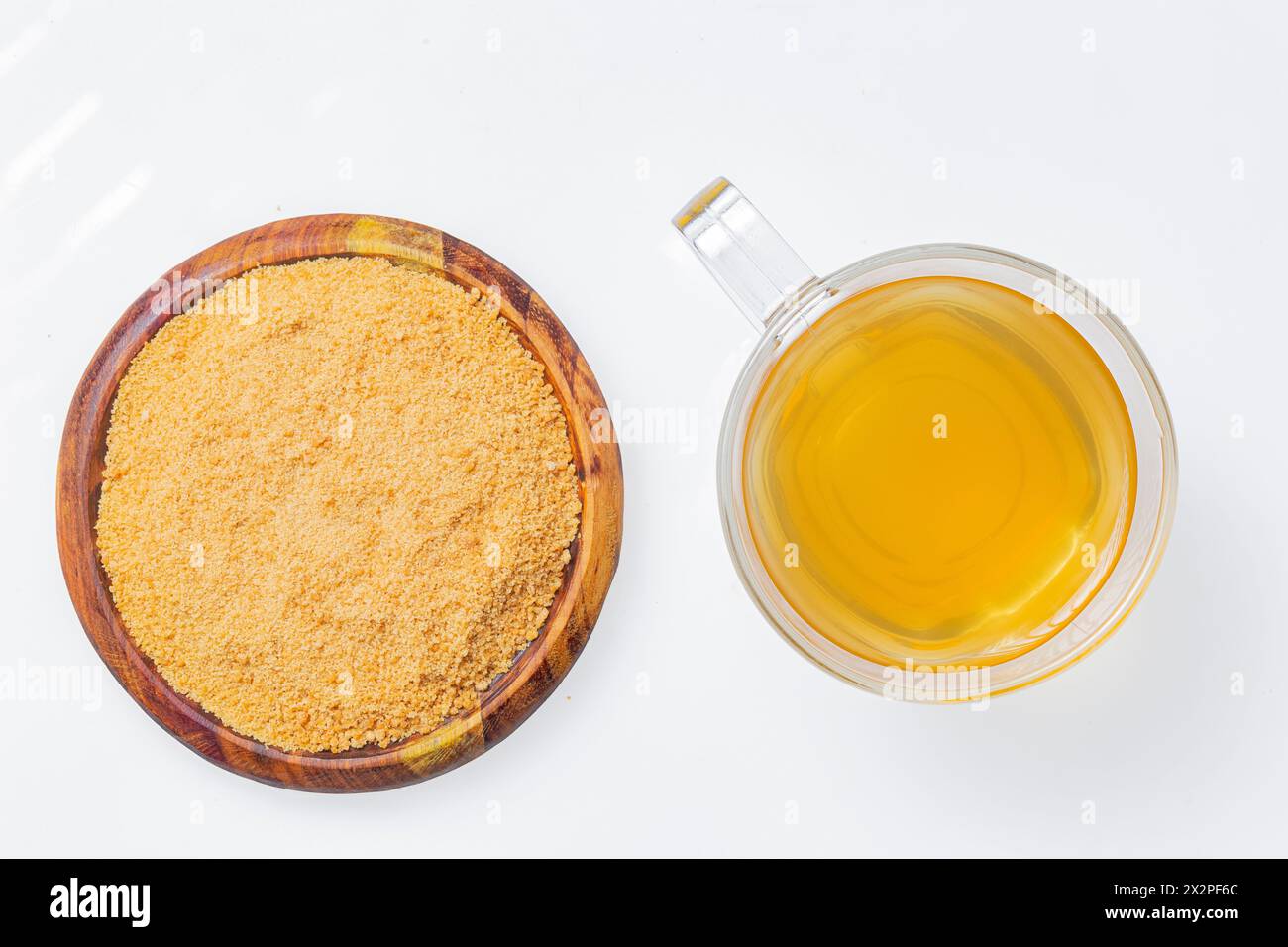 Drink of piloncillo and ground piloncillo, on white background ...