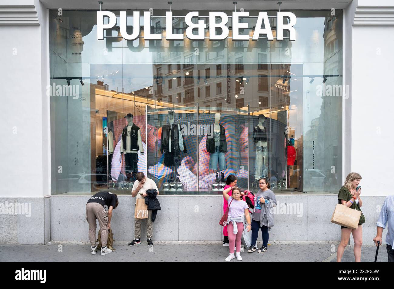 Shoppers are seen outisde the Spanish multinational clothing design ...