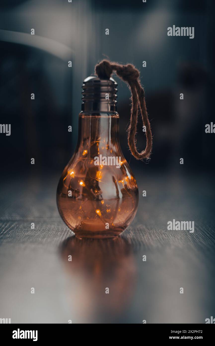 The dim light of a mysterious lamp against a gloomy background. Design ...