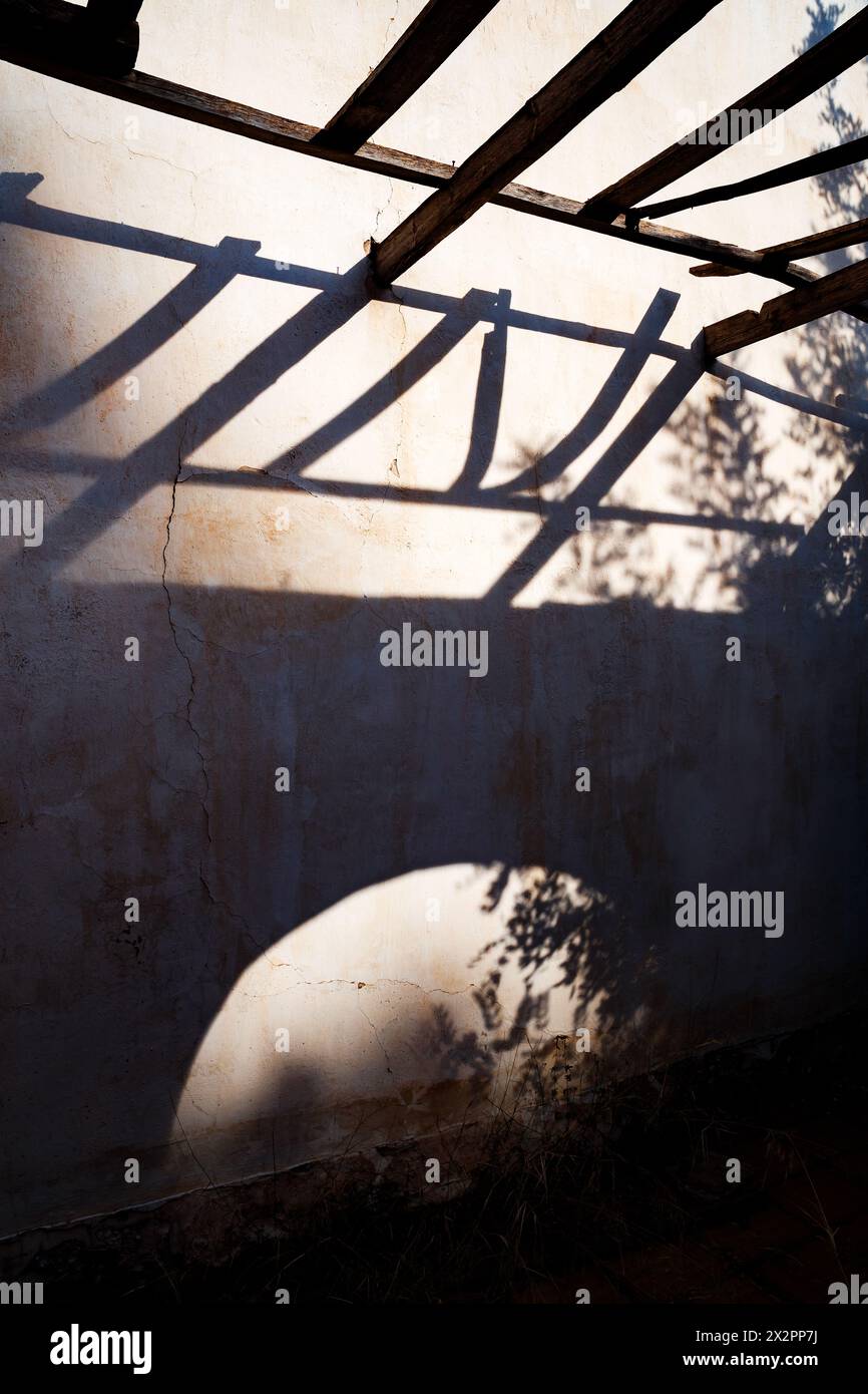 Shadows of arches and beams on the facade in Sella Stock Photo - Alamy